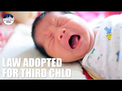 China adopts law amendment allowing couples to have three children
