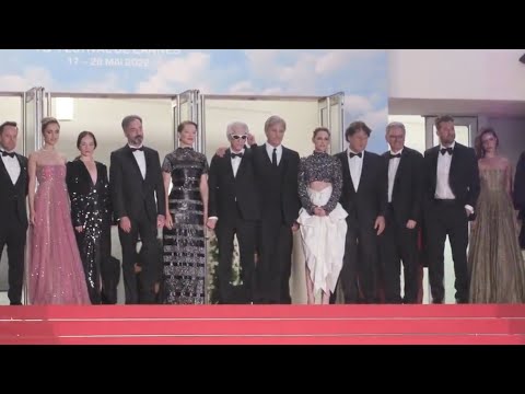 The cast of David Cronenberg's Crimes Of The Future poses at the Cannes red carpet
