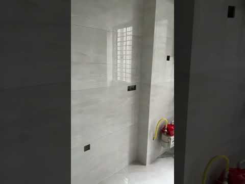 What tile grout color is more versatile?