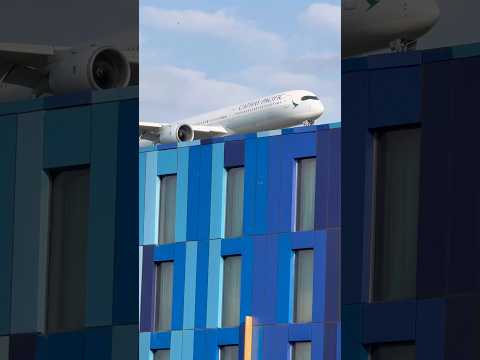 Airbus A350 flies low over the building 😮✈️ #airbus #aviation #planespotting