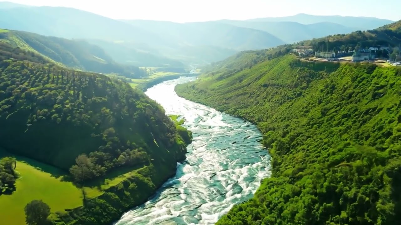 River Cutting Through Emerald Mountains