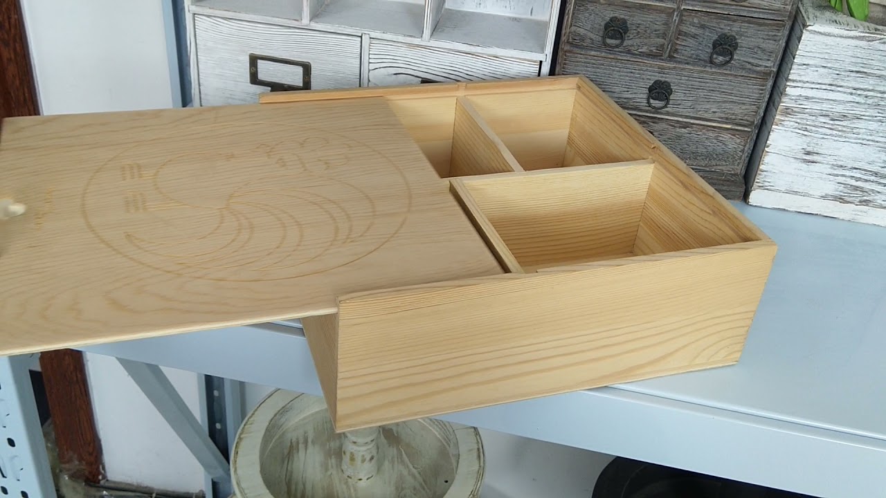 Storage box with sliding lid