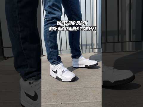 White and black Nike Air Trainer 1 on feet