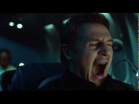 Liam Neeson Yawns on a Plane