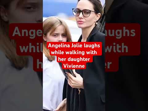 Angelina Jolie laughs while walking with her daughter Vivienne