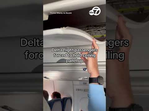 Delta flight passengers forced to hold ceiling panel up