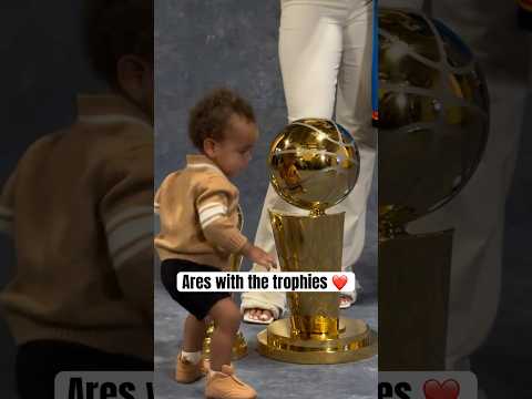 Shai’s son checks out the trophies 🏆