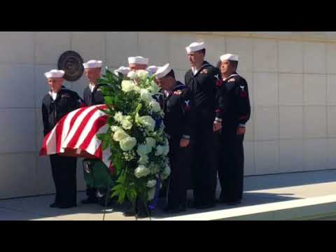 Community, Navy officers pay their respects to fallen hero