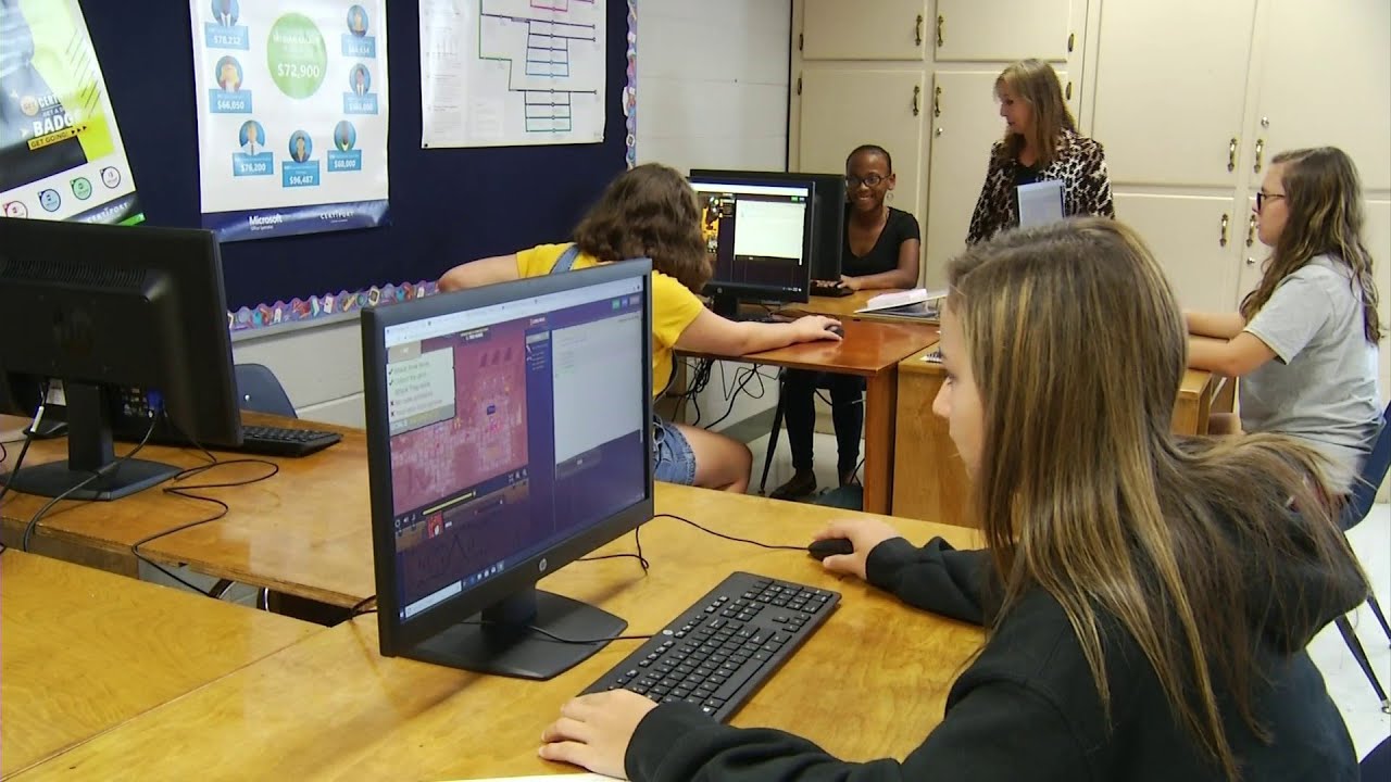 High schoolers taking required computer, coding class
