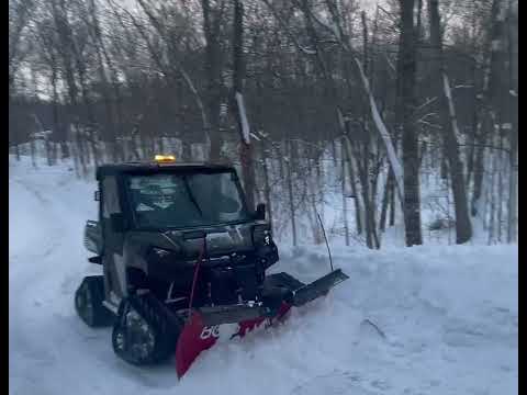 Polaris Ranger with tracks and Boss Vee Plow cleaning up snow!