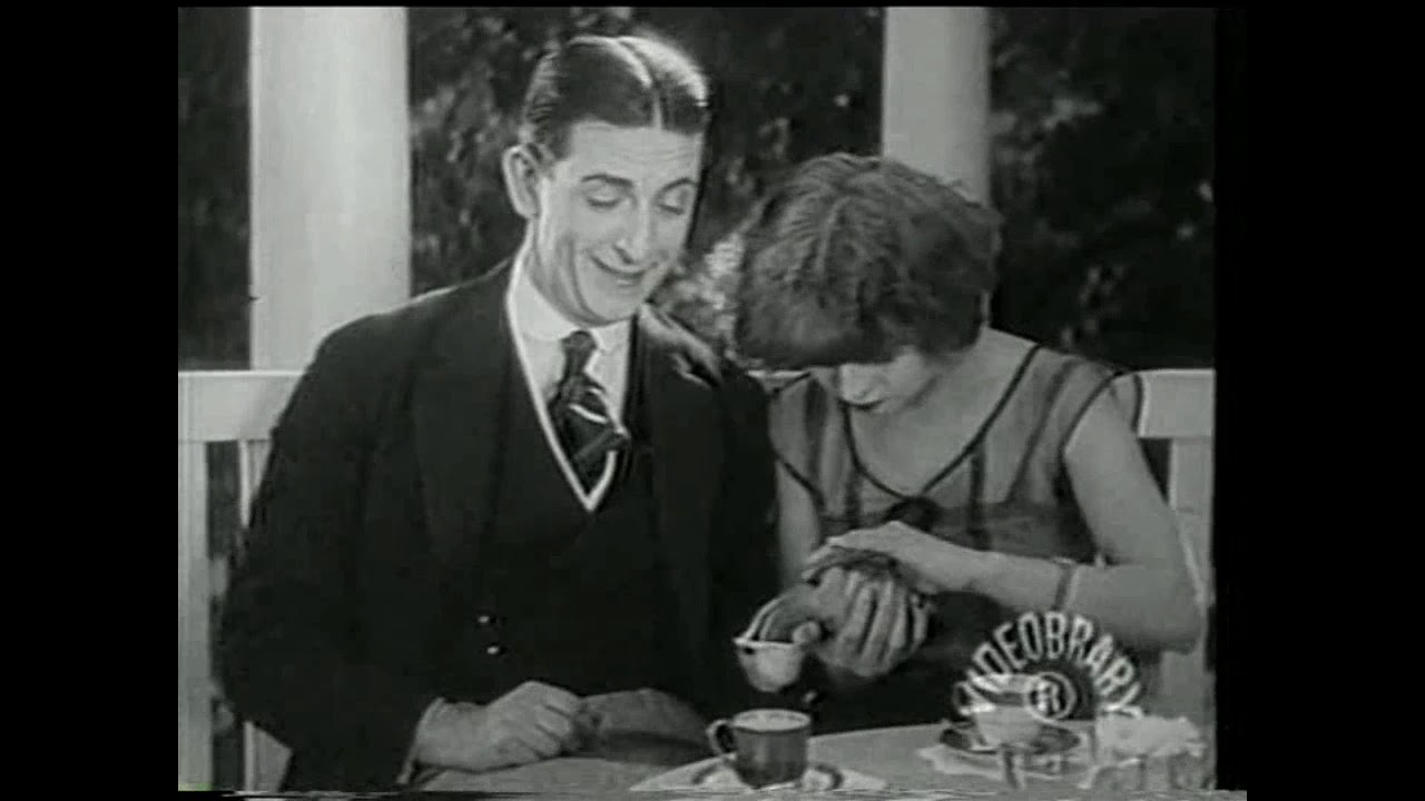 Clara reads Eddie's palm in Helen's Babies (1924) - Clara Bow and Edward Everett Horton