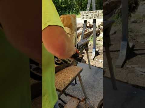 Santa Claus chainsaw carving . Time lapse