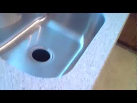 Livingstone solid surface countertop with a coved back and E220 undermount Karran sink