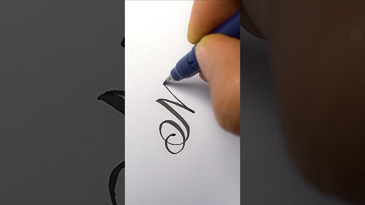 'M' calligraphy style.