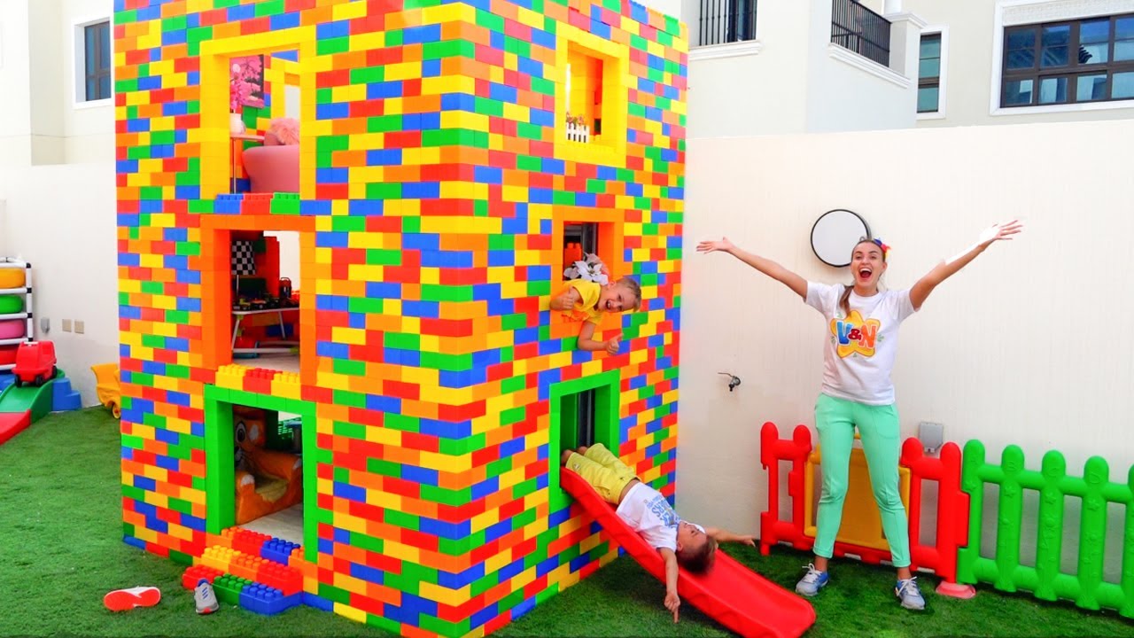Vlad and Niki play with colored toy blocks and build Three Level House