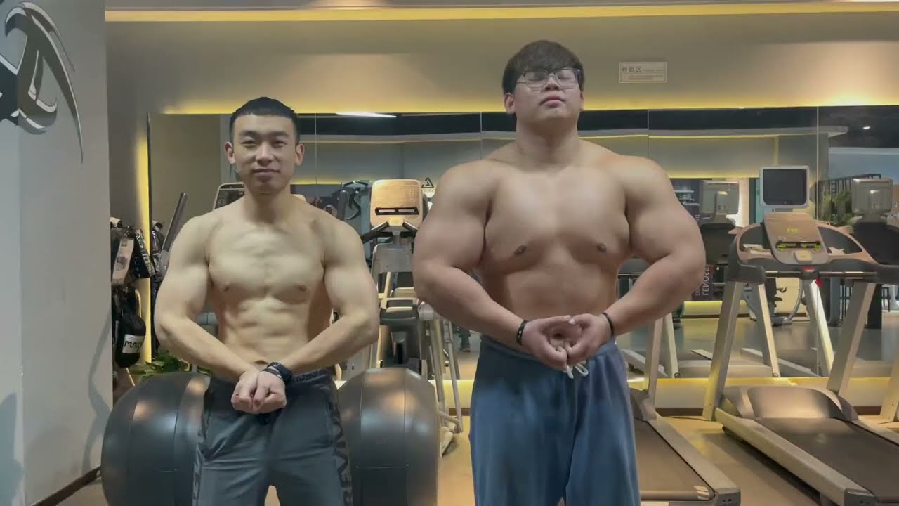 Two Young Chinese Bodybuilder Muscle Flexing