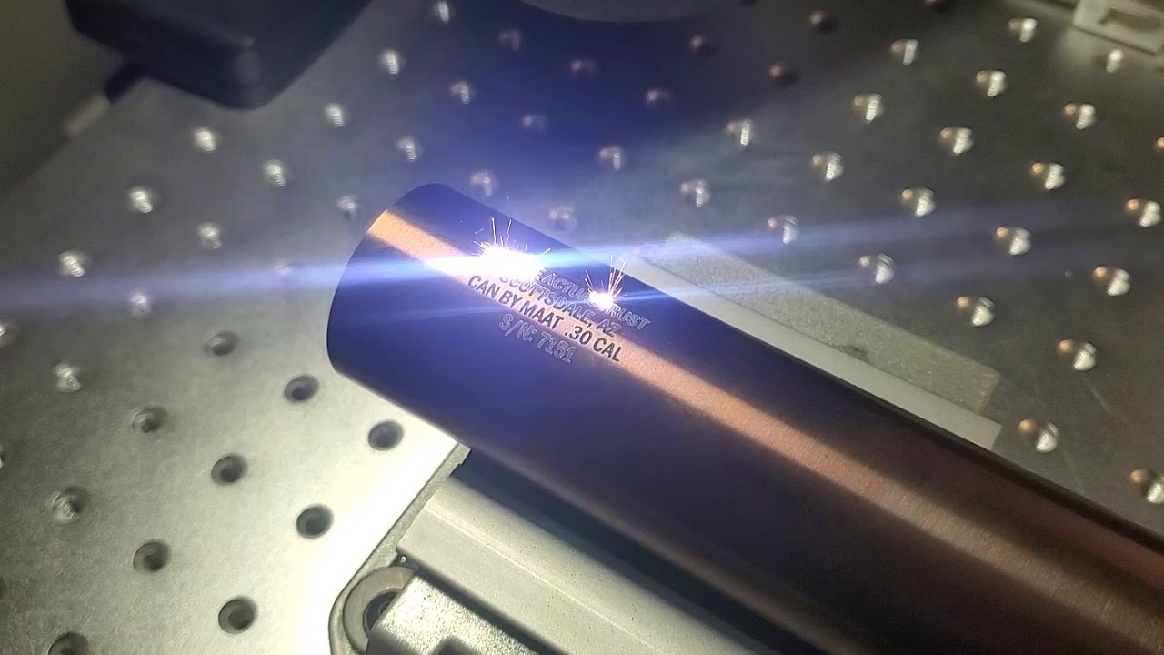 Laser engraving NFA maker's markings on a titanium suppressor