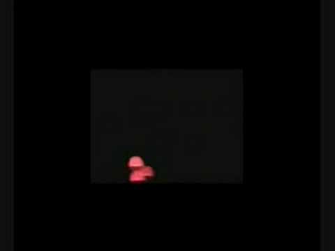 weird black triangle UFO with red lights with laser. Spaceship?