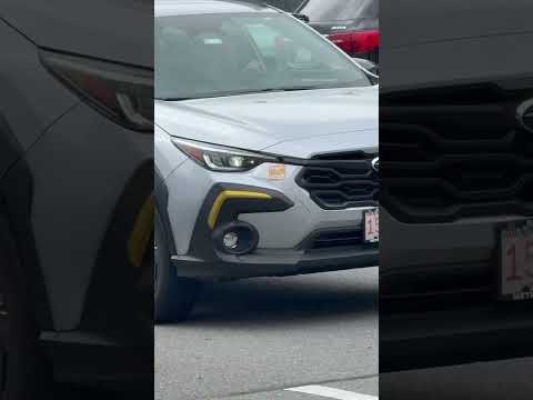 Chrysler stalking sliver Subaru passes at the local shopping center