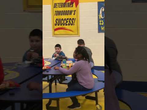 Mrs. Ratajski presents 4th Grade Student of the Month Award
