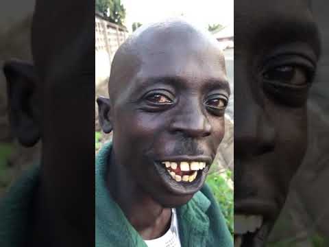 Black bald man with big teeth laughing video meme template || The Unknown Sarcasm