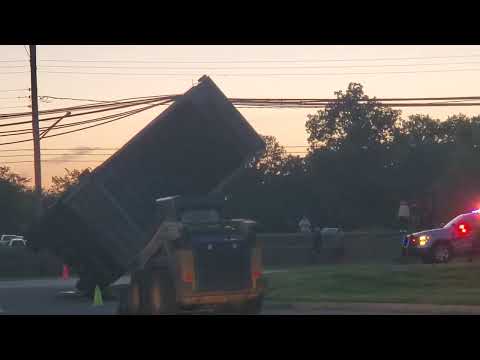 Dump-truck takes out power-lines.