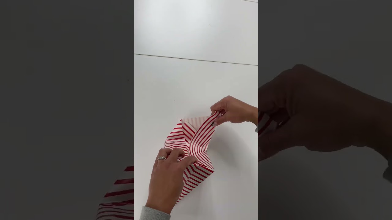 How to gift wrap a triangle shaped item #wrappinggifts #wrappinghacks #giftwrapping