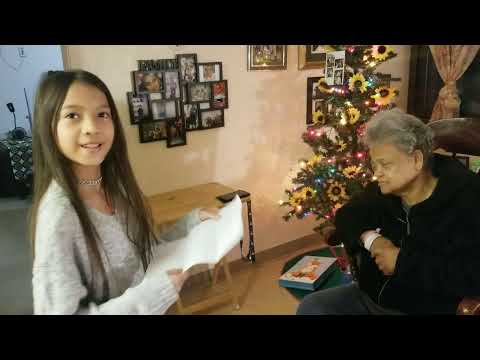 Asian girl speaking Spanish to grandma on Christmas. (abuelita)