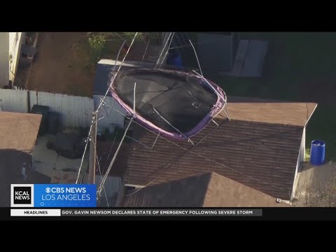 Strong winds cause damage around LA, sinkholes swallow cars
