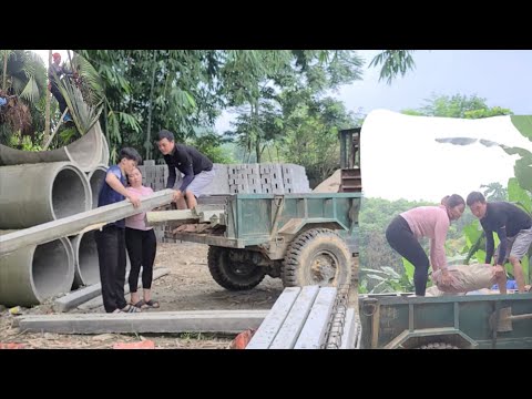 Ms. Dam helps Mr. Vang prepare materials to build a new house.