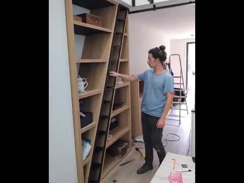 This bookshelf designed for a tiny home hides a sleek staircase. Watch the video!