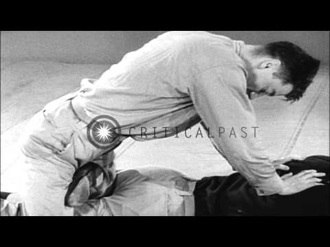 A US Navy Training program teaches the sailors kneeling defense and prone defense...HD Stock Footage