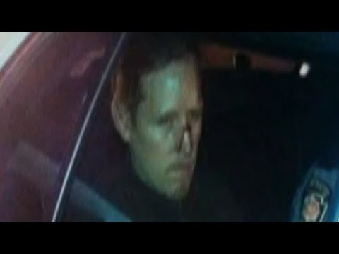 New image of suspect in custody