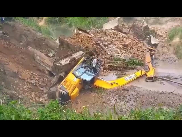 WATCH: Excavator operator escapes injury as unit overturns at Troy ...