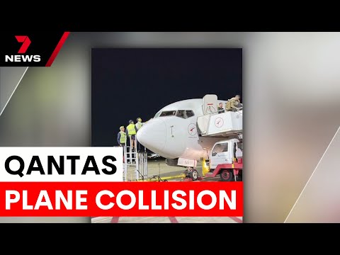 Qantas plane collides with aero bridge at Brisbane Airport | 7NEWS