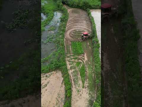 Aerial view of tiller plowing the field