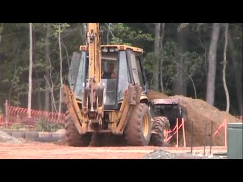 Cat 416C IT spreading fill