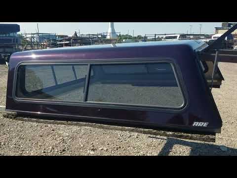 Used fiberglass cab high truck camper shell. Fits 07-13 Chevy 5.8' bed cab High, Black cherry color