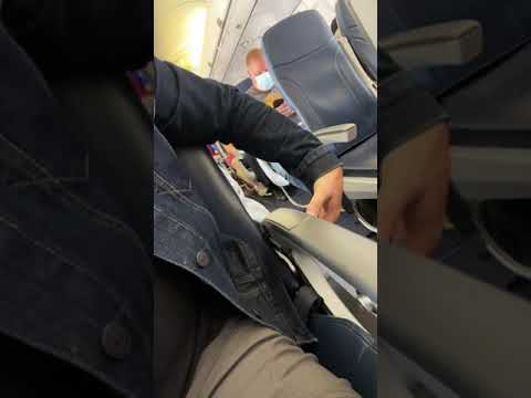 How To Get The Aisle Seat Armrest Up On An Airplane.