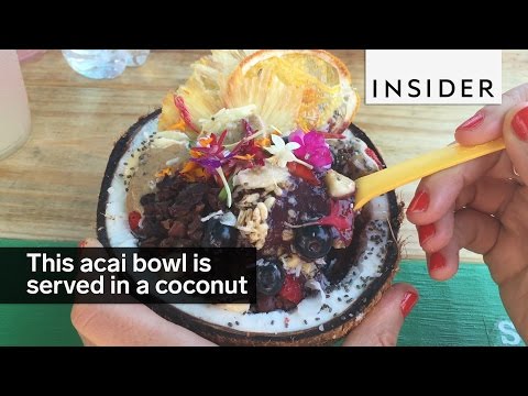 This beautiful acai bowl is served in a coconut
