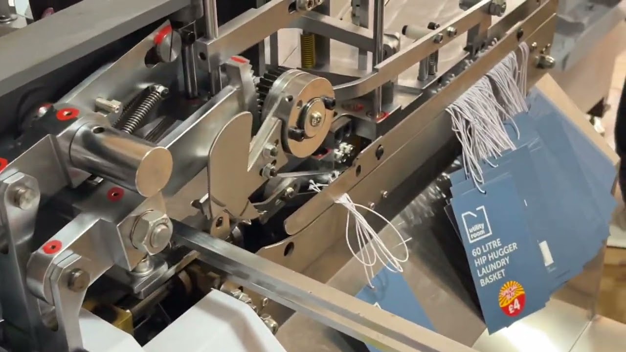 Tag stringer machine