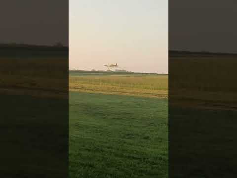 this is just a video of a crop duster crop dusting over a fed in front of my house
