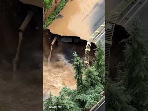 Huge sinkhole SWALLOWS road