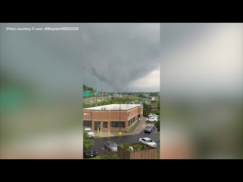 Onlookers catch rotating clouds Tuesday near Independence