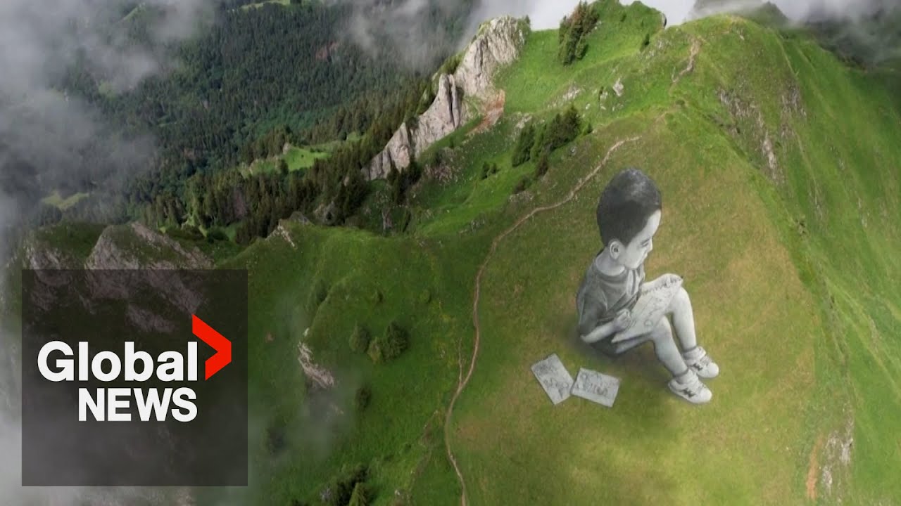 Swiss mountains become giant canvas for artist SAYPE