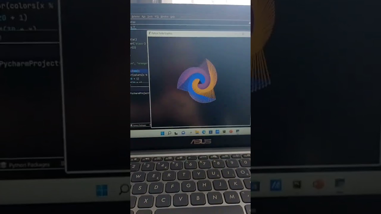 Orange, purple and blue spiral triangle in python turtle