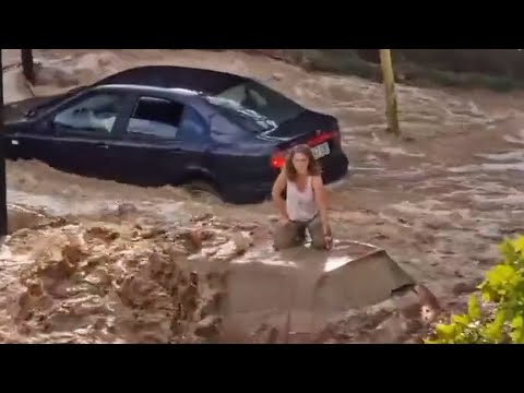 It's a dark day for Spain! Flooding in Zaragoza! Streams of water demolish cars