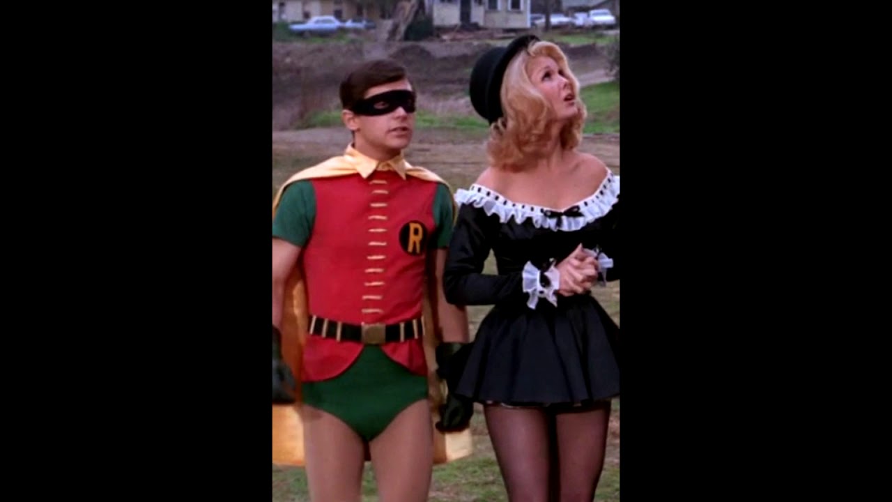 robin in peril walking with his girlfriend