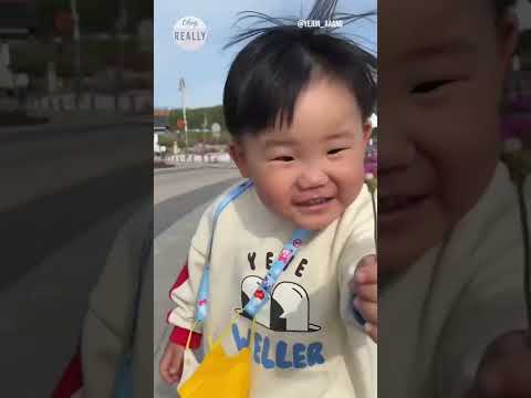 Kid loses dandelion whilst running to show mum #shorts #dandelions #cutekids