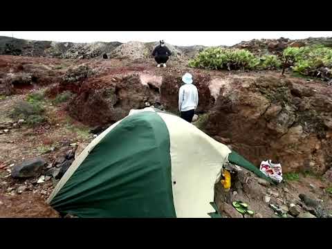 Migrants leave Red Cross camp for island cliffside